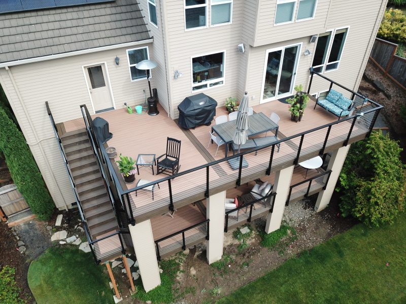 Two story Trex deck with cable rail and cedar ceiling - Deck Masters, LLC