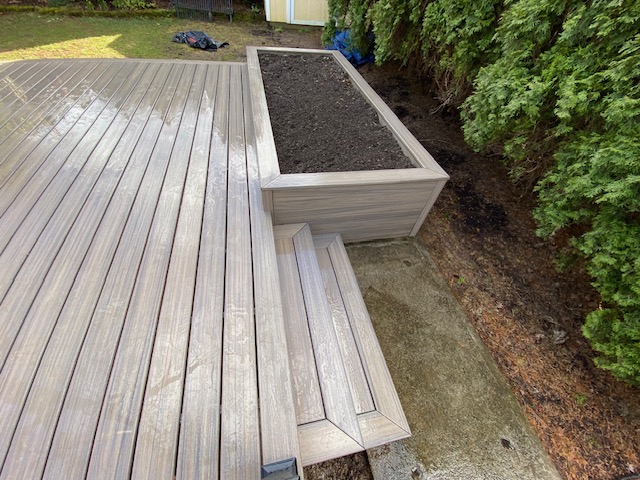 Tree-Integrated Trex Enhance Deck with Picket Rails and Garden Box - Deck Masters, LLC